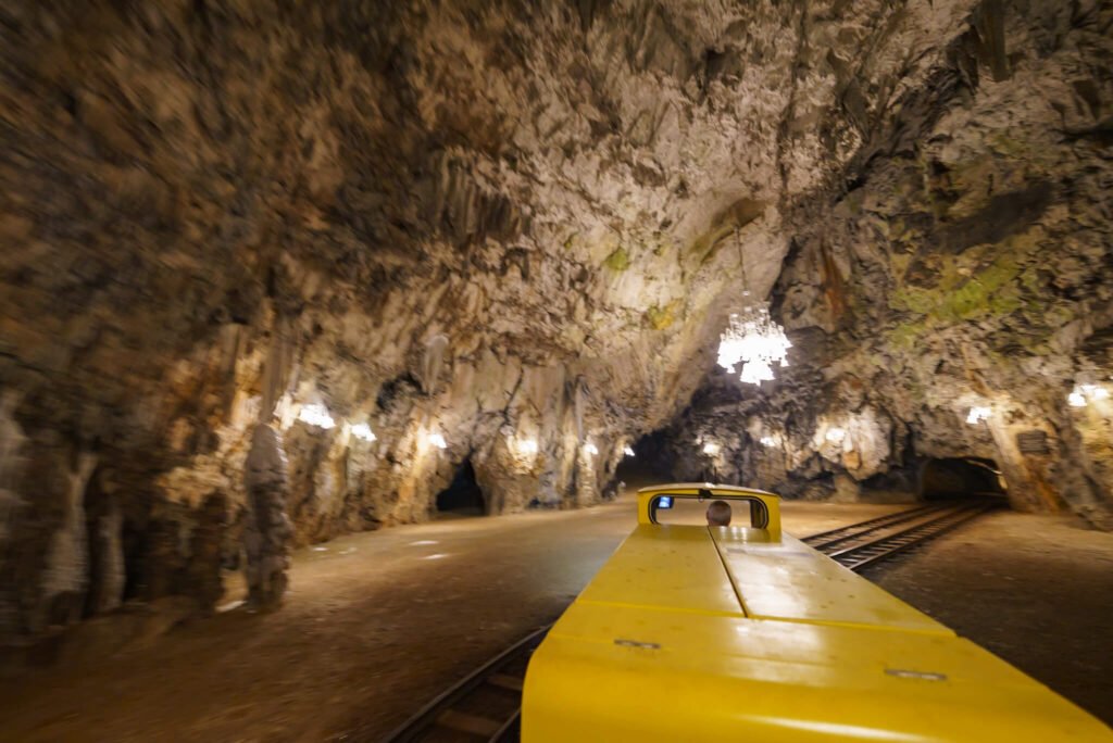 Postojna Cave: Experiencing an Open-Air Train Ride Through a Cave in ...